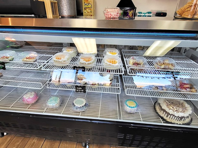 A showcase of sweet possibilities, each shelf telling its own delicious story through carefully arranged desserts.