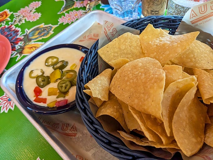 These aren't your average tortilla chips &ndash; they're crispy vehicles for that vibrant sauce studded with jalape&ntilde;os and fresh vegetables. Photo credit: Tonya McNabb