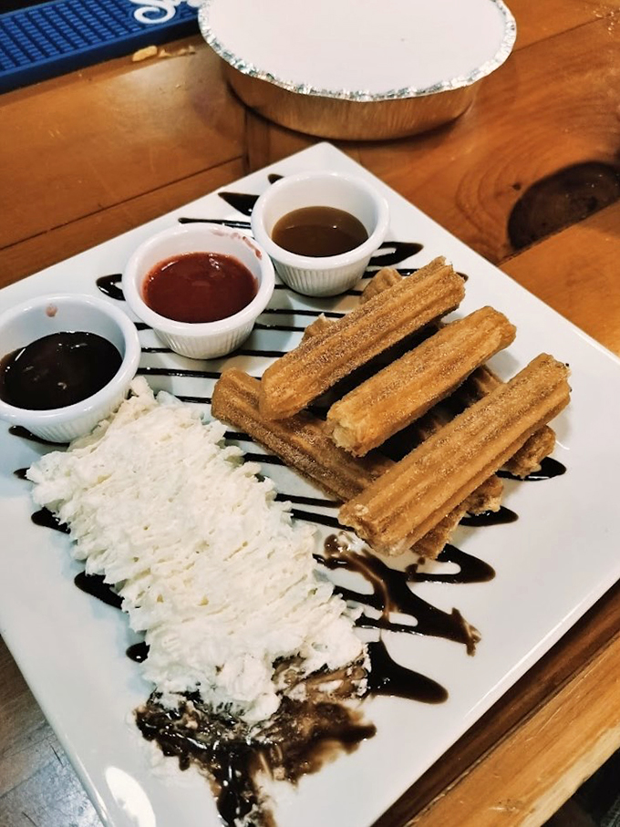 These cinnamon-sugar dusted churros come with three dipping sauces, because sometimes one sweet ending isn't enough.