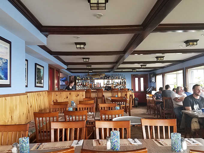 Welcome to the coziest corner of Maine. This dining area feels like you've been invited to a seaside family reunion, minus the awkward small talk.