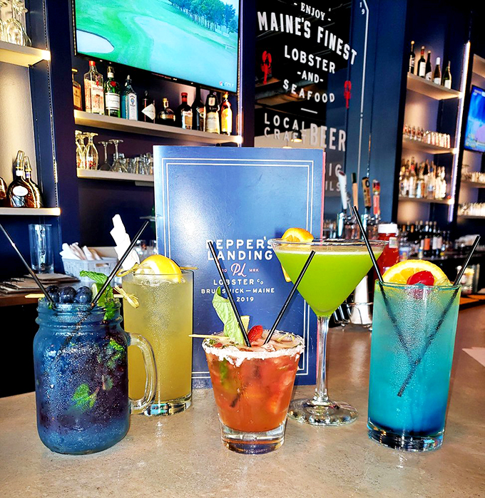 A rainbow of craft cocktails that look like the ocean decided to throw a party.