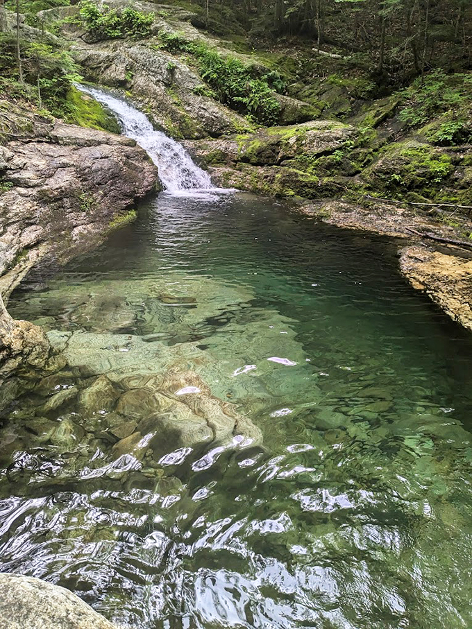 Crystal-clear waters reveal every stone beneath the surface, like nature's own jewel box on display.