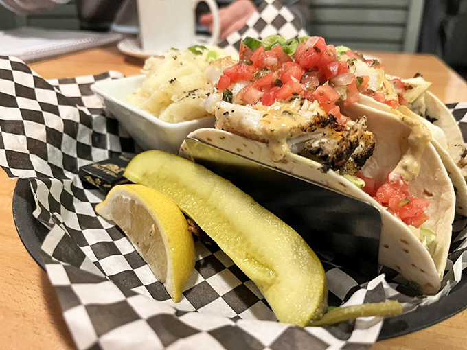 Fresh catch tacos dressed up with enough colorful toppings to start their own farmers market. 
