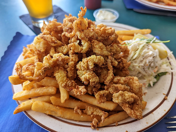A mountain of golden-fried clams proves that sometimes the best things in life come in crispy, bite-sized pieces.