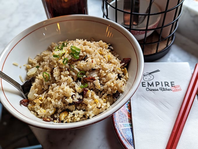 Not your average fried rice &ndash; each grain dances with flavor, studded with savory bits and bright green onions.