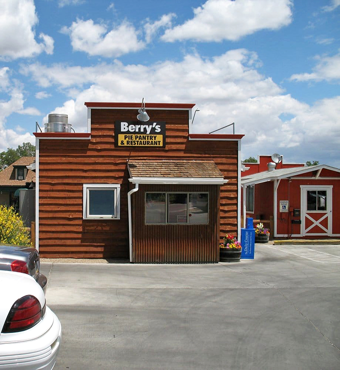 The weathered wood exterior tells stories of decades serving hungry locals and lucky travelers passing through.