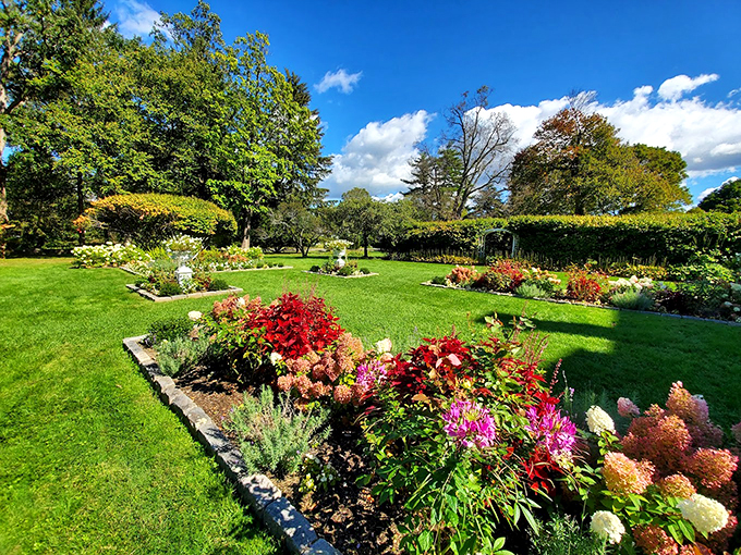 A masterclass in Victorian garden design, where every bloom seems to have received an etiquette lesson.
