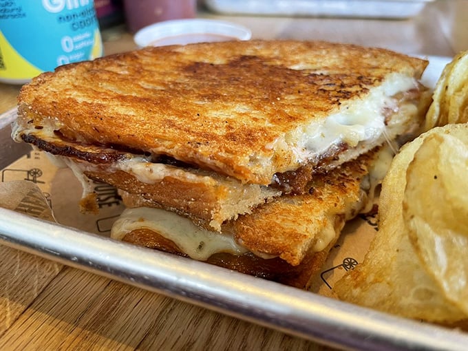 Crispy edges, gooey center, and a side of house-made pickles &ndash; this sandwich knows how to make an entrance. Photo credit: Joanna R.