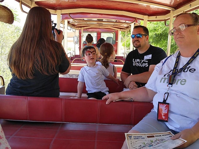 "I'm on a boat!" Er, make that a stagecoach. These folks are getting a bumpy taste of 19th-century travel, minus the bandit attacks.