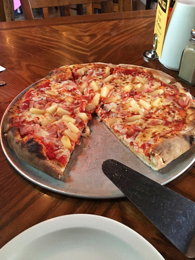 The pizza that launched a thousand debates! Whether you're Team Pineapple or not, this pie is sure to spark conversation.