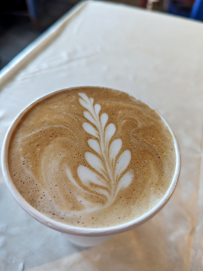 This latte's leaf design isn't just art &ndash; it's a morning masterpiece waiting to wake up your taste buds.