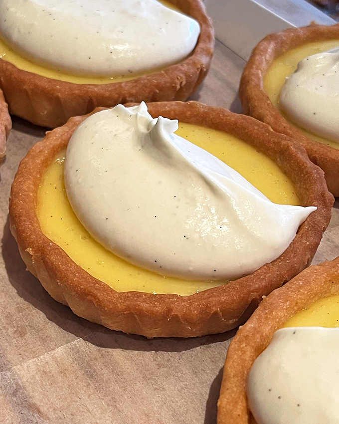 Lemon tarts topped with clouds of vanilla cream. Pucker up, buttercup &ndash; these zesty delights are ready for their close-up!
