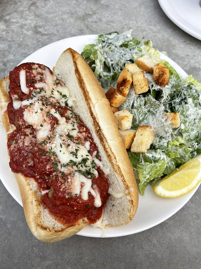 A meatball parm that would make any Italian grandmother proud, served with a side of perfectly dressed Caesar salad.