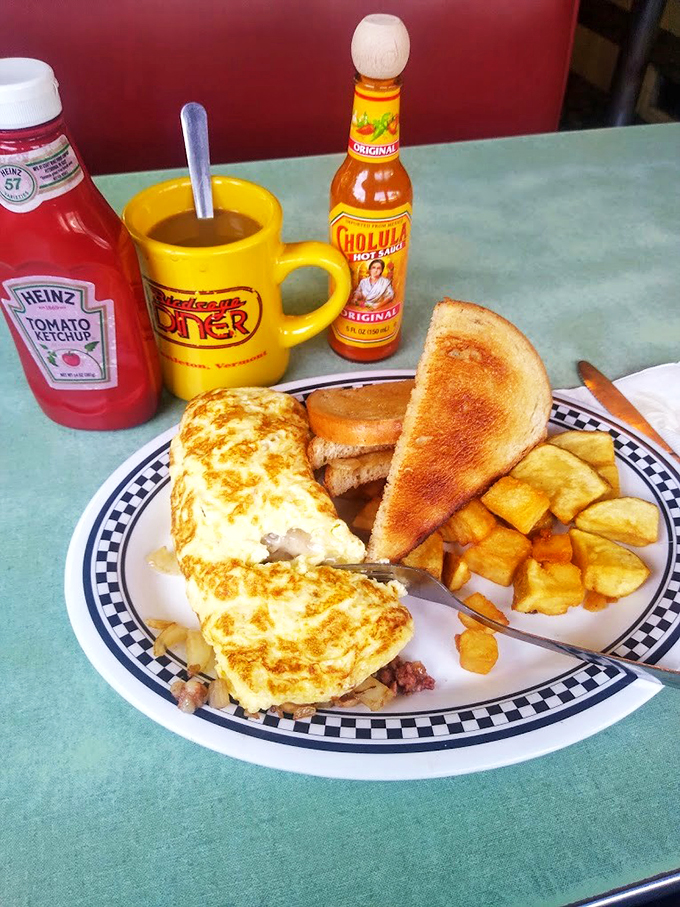 This omelet is so perfectly folded, it could teach origami classes. A golden envelope of cheesy, meaty goodness!