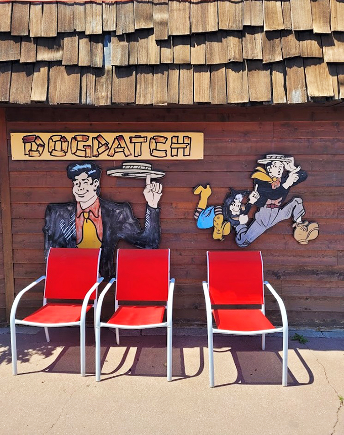 Red chairs await beneath playful cartoon characters, creating the perfect spot for a pre-dinner Upper Peninsula sunset viewing.