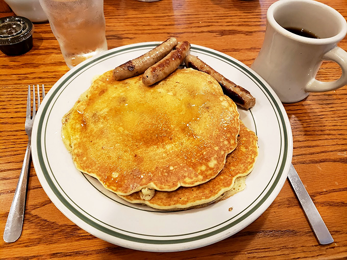 These pancakes are fluffier than a cloud's pillow, and those sausages? They're the savory yin to the sweet syrupy yang. It's breakfast nirvana on a plate.