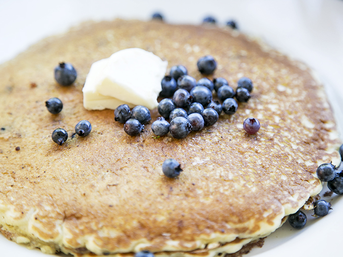 Maine blueberry pancakes with a pat of butter melting like a summer sunset. Simple perfection on a plate. Photo credit: Cafe This Way