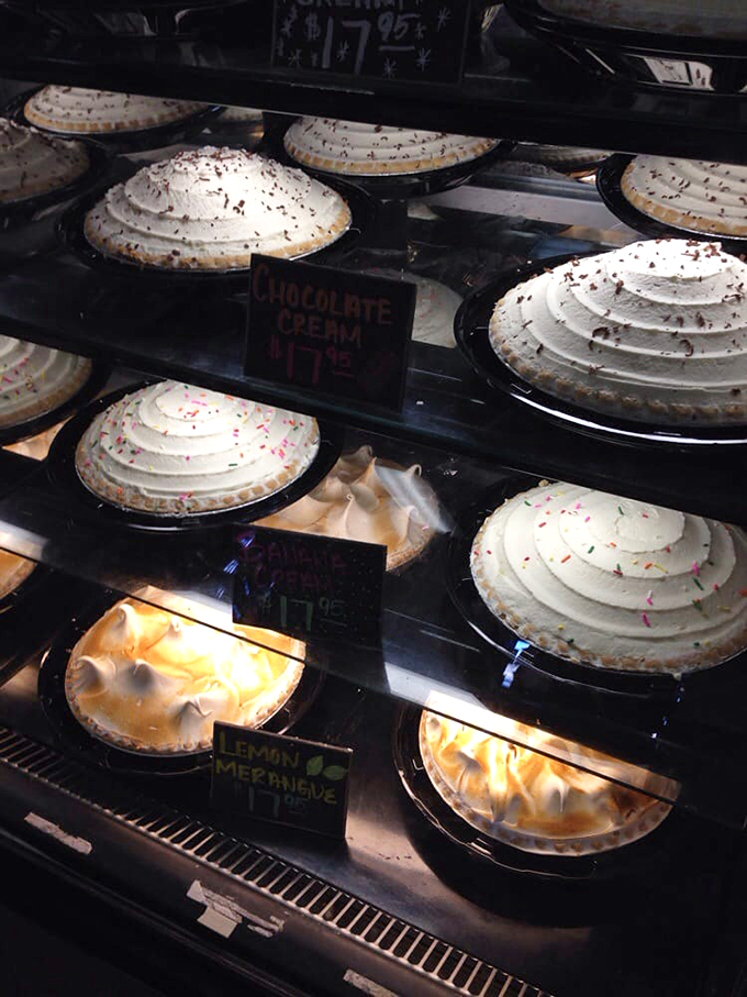 Cream pies stand at attention like soldiers of sweetness, their meringue peaks reaching for the sky. 