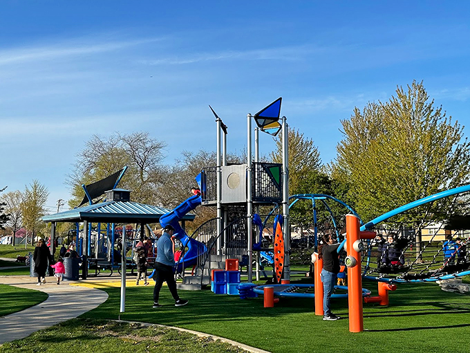 Blue slides and climbing structures reach skyward, promising adventure for kids and nostalgia for the young at heart.