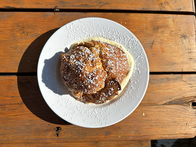 A perfectly puffed popover that's ready for its close-up, served with a side of pure breakfast joy.