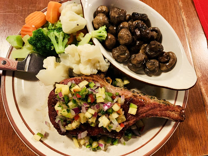 This pork chop's got more flair than a rodeo queen. Topped with zesty salsa, it's a fiesta for your mouth. Photo credit: Sherry L.