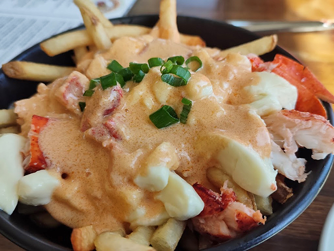 French fries meet their match with tender lobster and a creamy sauce that'll make you forget about ketchup forever. Photo credit: Petr Kalager