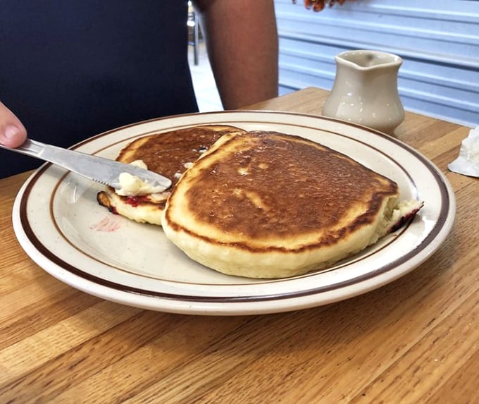 Pancakes and butter: The dynamic duo of breakfast. These fluffy stacks are ready to soak up syrup like a delicious sponge.