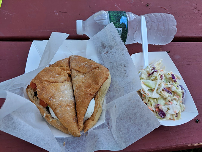 The classic combo: A butter-grilled sandwich meets fresh coleslaw, proving land and sea make excellent neighbors. Photo credit: Jared Poelman