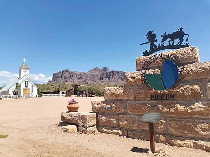 The museum's entrance sign perfectly captures the intersection of Western heritage and Hollywood dreams beneath the Superstition Mountains.