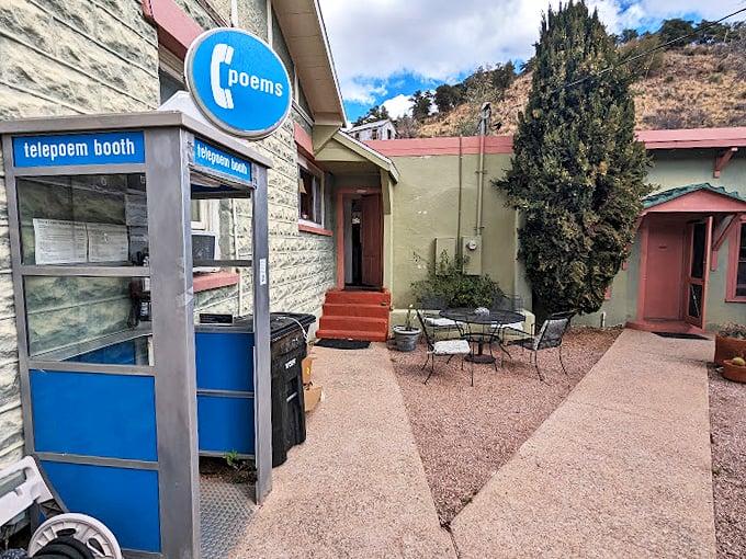 The blue-and-white booth stands sentinel, ready to deliver verses to anyone seeking a moment of literary escape.