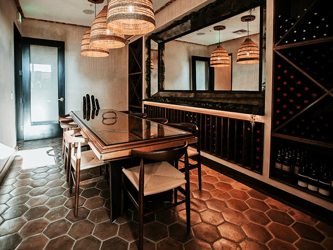 Mid-century modern meets industrial chic in this intimate wine room, where every detail whispers "stay awhile."