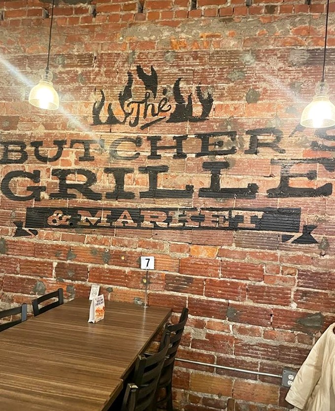 Rustic brick walls tell stories through vintage-inspired typography, creating an atmosphere that's both industrial and intimate. 