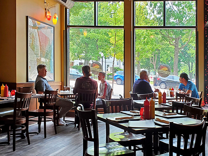 Window seat to happiness! Bask in the glow of good food, great drinks, and the charm of Madison's streets.