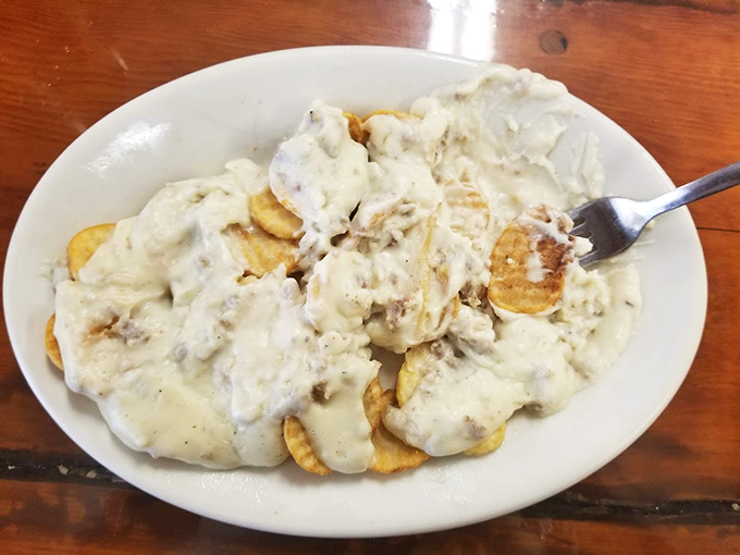 Biscuits and gravy, the breakfast of Southern royalty! These golden pillows of joy are drowning in a sea of peppery, meaty bliss.