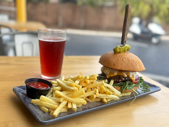 A burger so juicy, you'll need a napkin and possibly a bib. Paired with fries and a cold brew, it's the holy trinity of comfort food. Photo credit: Toby