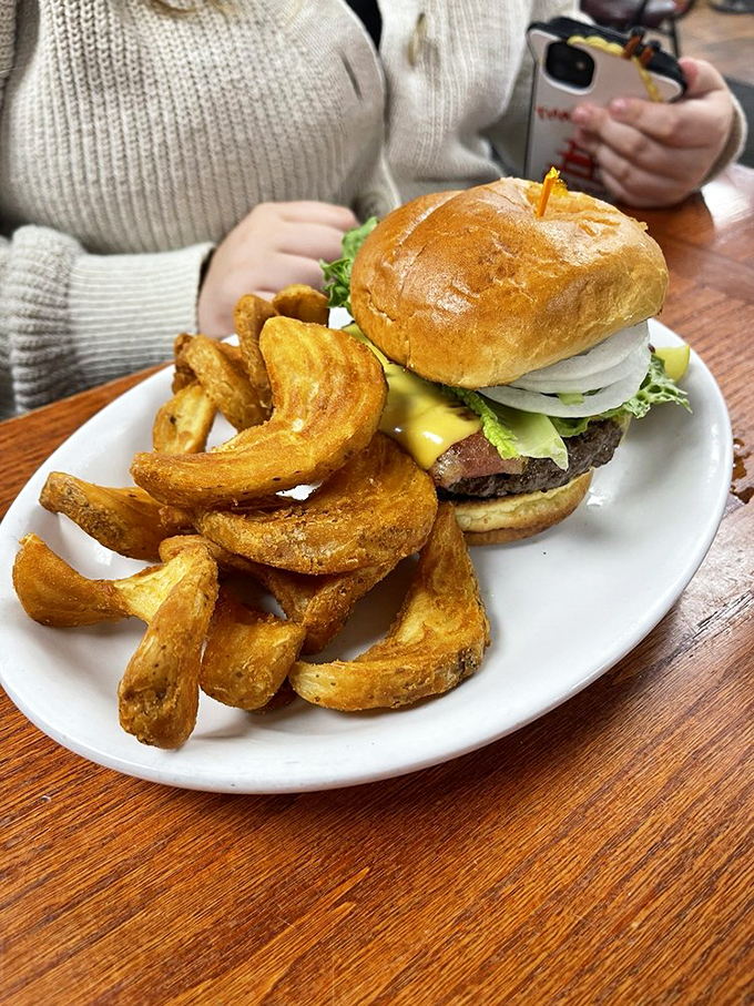 This isn't just a burger—it's a work of art. Van Gogh had his "Starry Night," we have this beefy masterpiece with a side of golden fries.