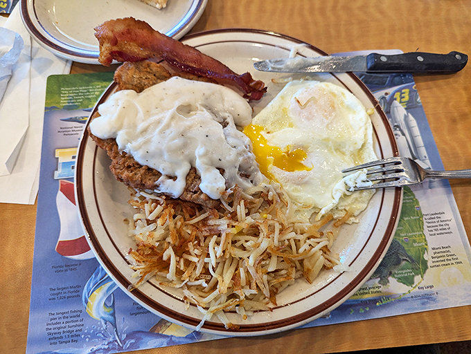 Country fried steak: where breakfast meets dinner in a crispy, gravy-covered embrace. It's the ultimate comfort food compromise! Photo credit: Jose Ruiz