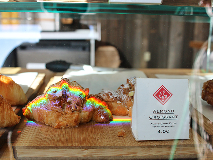Behold the Mona Lisa of pastries! This almond croissant, basking in rainbow light, looks almost too beautiful to eat. Almost.
