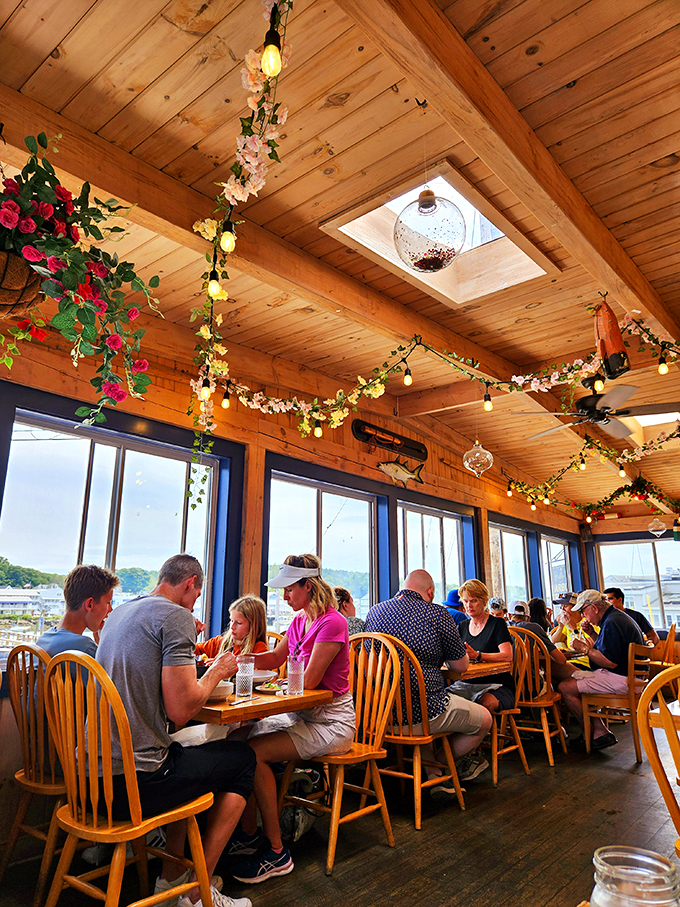 A dining room that's part coastal charm, part festive treehouse. With twinkling lights and harbor views, it's the perfect spot for making memories &ndash; and seafood decisions.