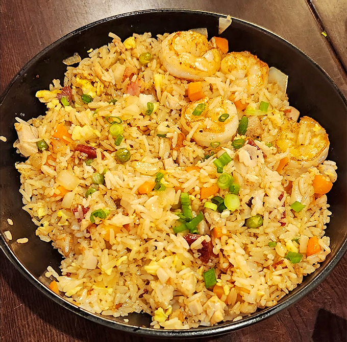 This isn't your average takeout fried rice. It's a symphony of flavors that would make even Uncle Roger nod in approval.