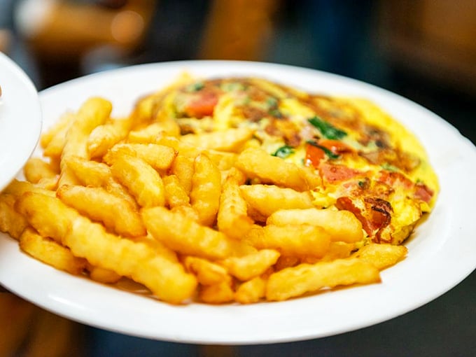 This omelet is folded more perfectly than Marie Kondo's sock drawer. A golden pocket of joy that sparks breakfast bliss.