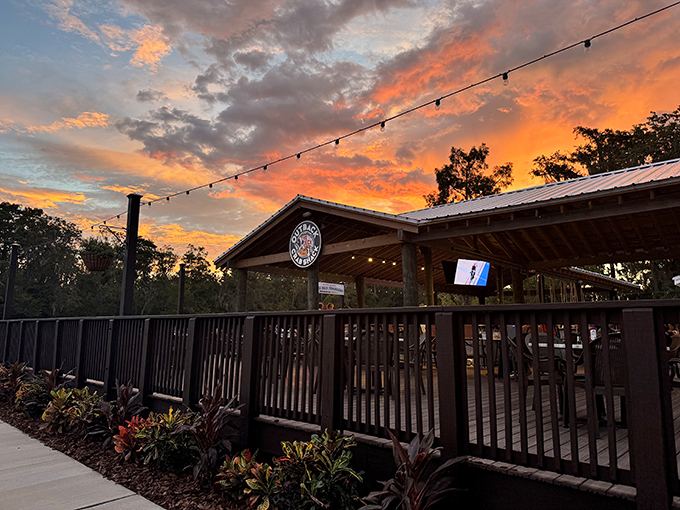As the sun sets, the patio comes alive. It's like Mother Nature's own dinner theater, with you as the star. Photo credit: Outback Crab Shack