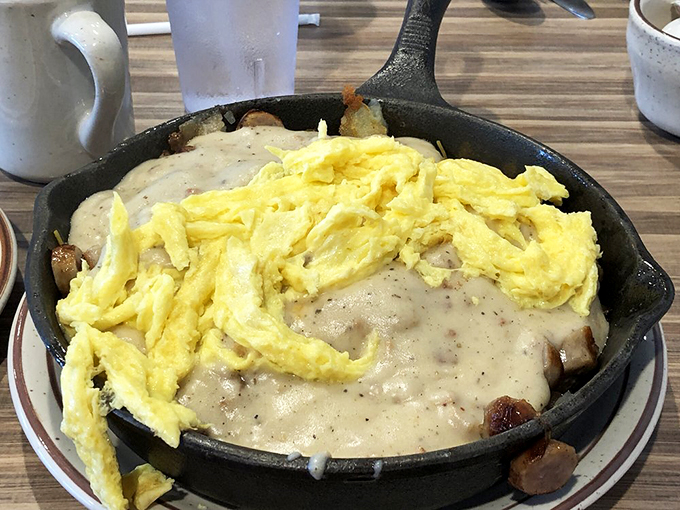 Breakfast goes bold in this sizzling skillet, where fluffy scrambled eggs meet melted cheese in a morning romance for the ages.