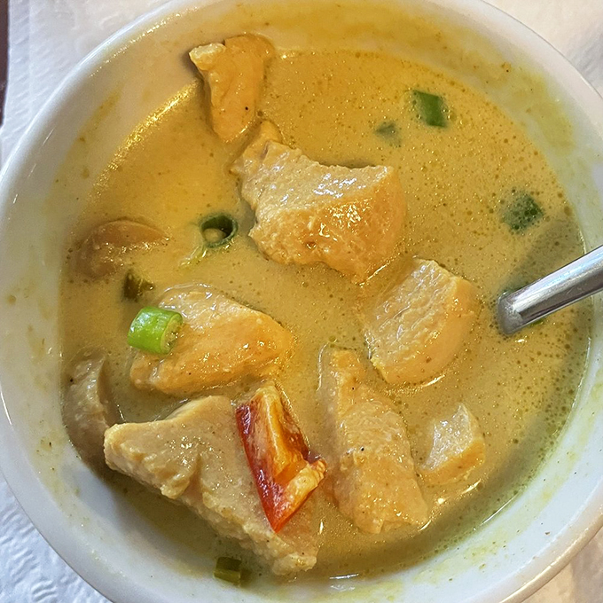 Soup's on! This spicy coconut concoction looks like it could warm you up faster than a Florida heatwave. Spoon at the ready! Photo credit: Janis A.