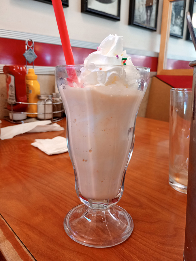 Pretty in pink and sweet as can be! This strawberry shake is like summer in a glass, with sprinkles on top for good measure.