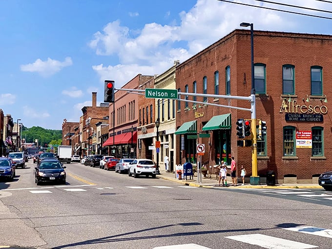 Summertime on Nelson Street: when the charm dial is turned up to 11 and every awning invites you in for a cool respite.