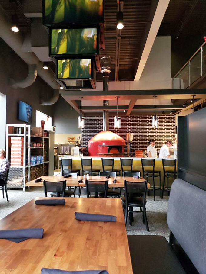 Cozy booths, warm lighting, and the promise of pizza perfection. It's like the restaurant equivalent of a bear hug from your favorite uncle.