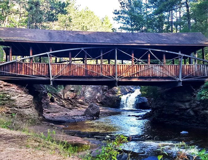 Rustic bridge meets rushing waters in a scene straight out of a postcard. Time to practice your "wish you were here" pose!
