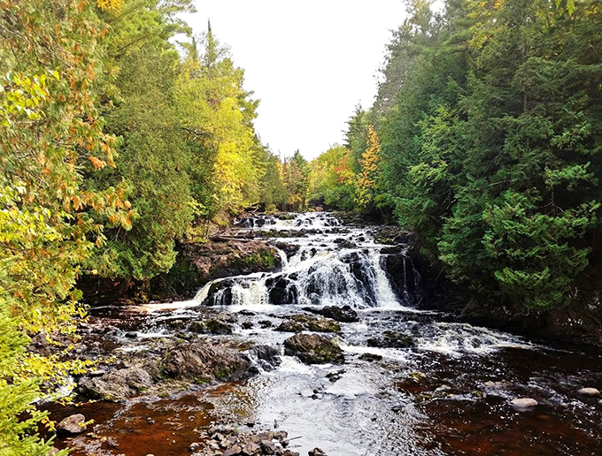 Nature's own water park! Russet waters tumble over ancient lava flows, creating a spectacle that's both serene and exhilarating.