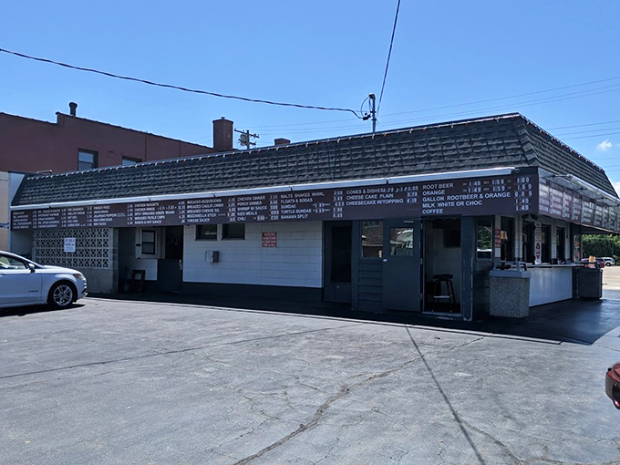 Flash those headlights for a bite of history! The Spot's been serving up car-side delights since Eisenhower.